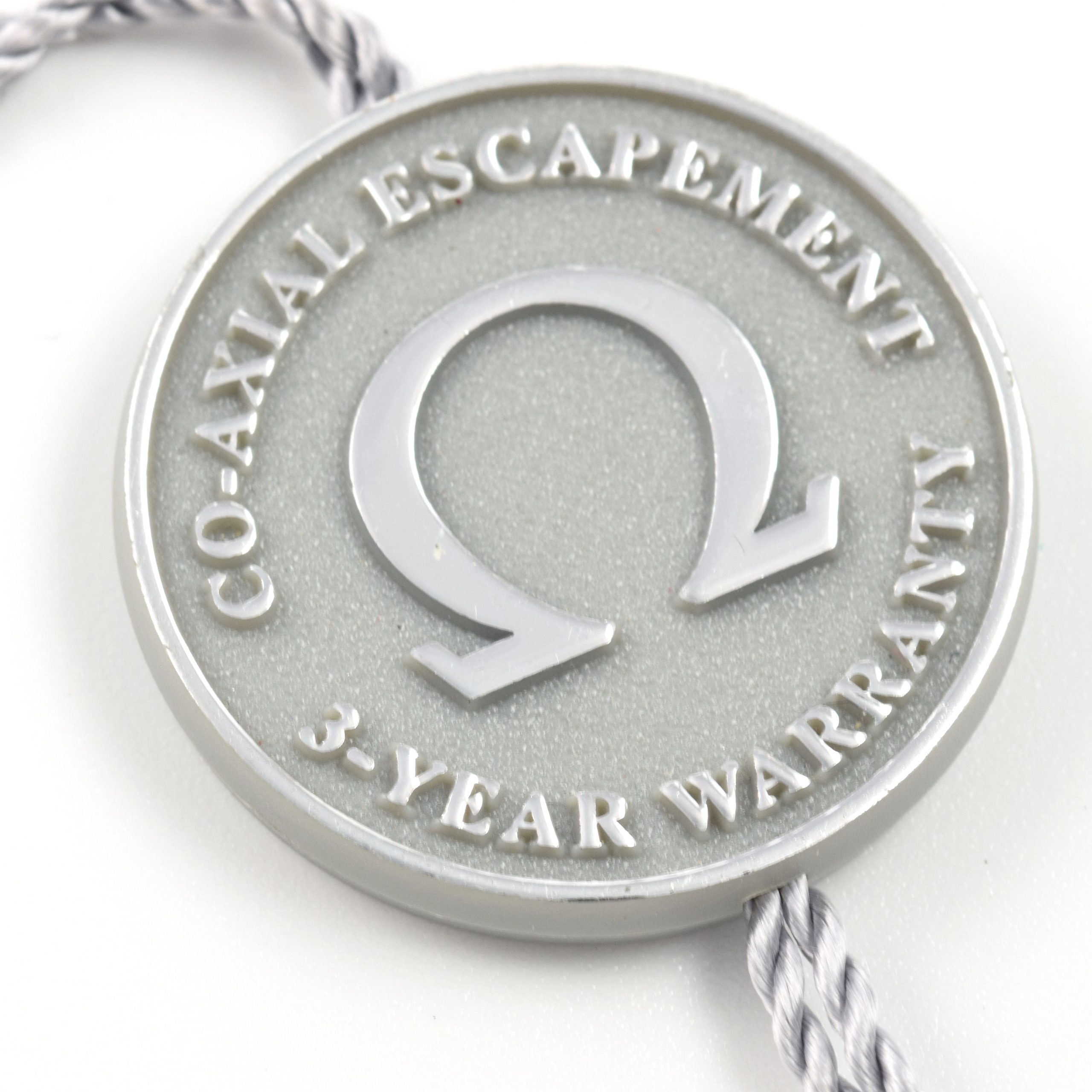 Omega Co-Axial Warranty Watch Swing Hang Tag with String - The Watch Link